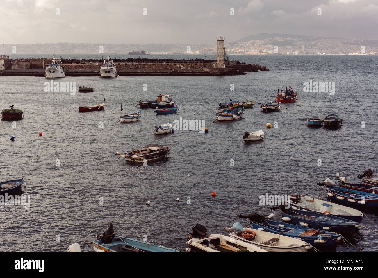 Berth with boats on sea shore Stock Photo - Alamy