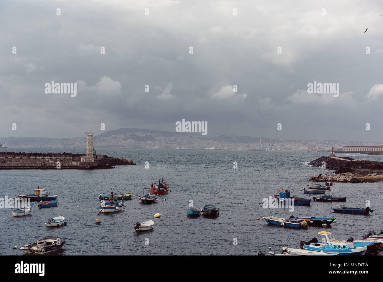Berth with boats on sea shore Stock Photo - Alamy