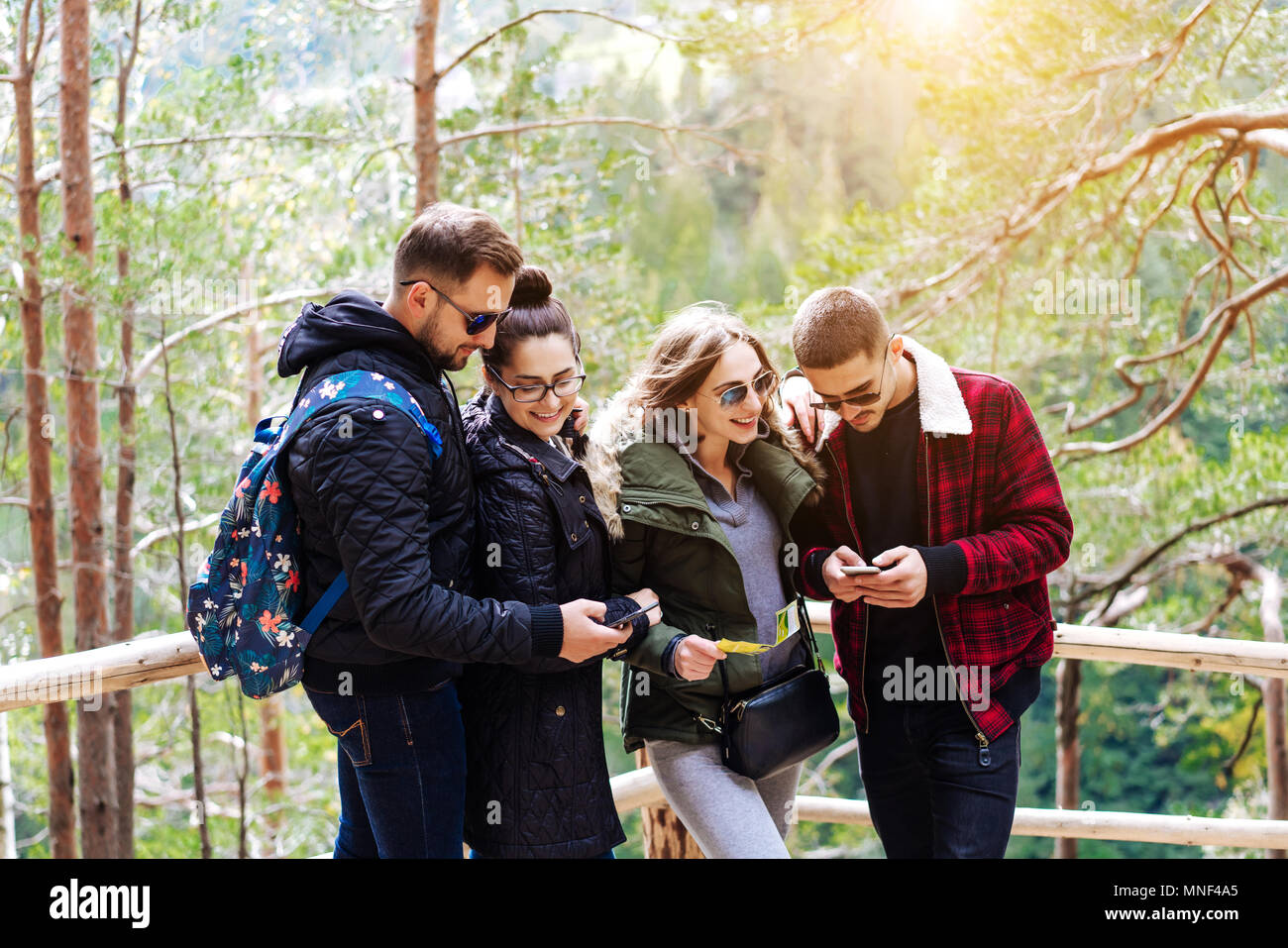 Four tourists trying to find the way Stock Photo - Alamy
