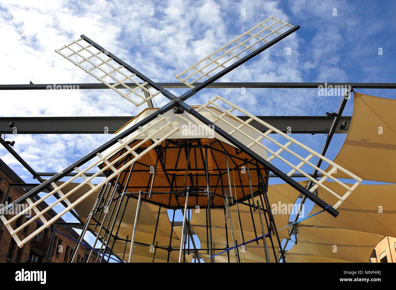 Windmill blades and sails under construction with blue sky background ...