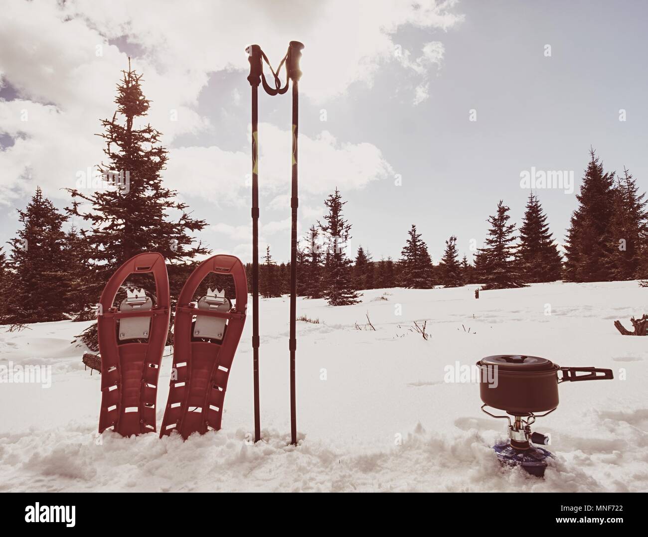 Cooking in front of tent in snow. Hiker camping in winter mountains ...