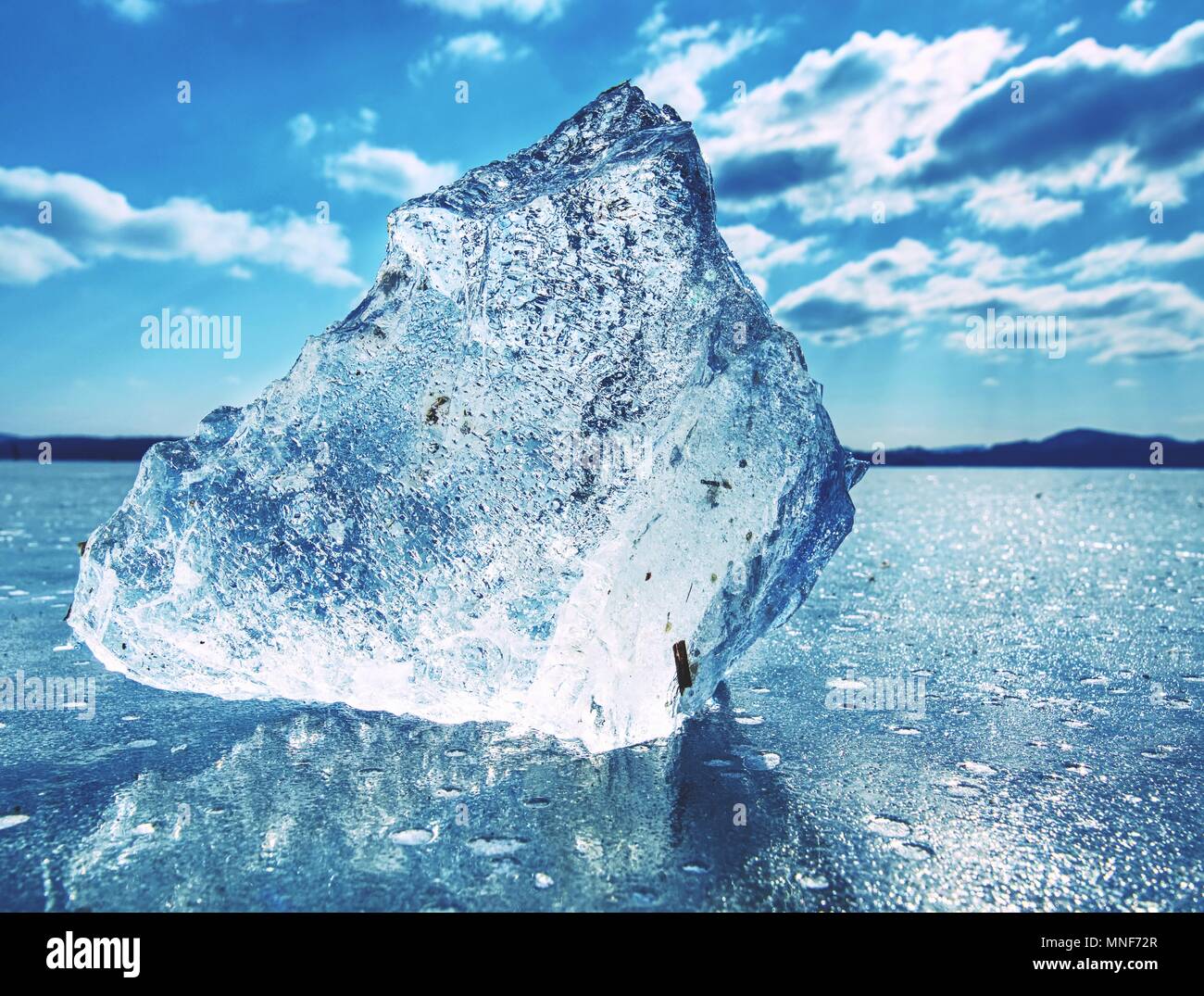 Big piece of ice with abstract cracks inside. Icicle block indetail ...