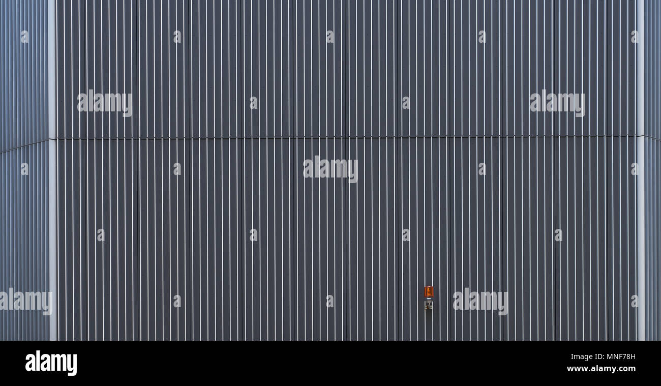 High-rise facade as a background Texture with orange warning lamp Stock ...