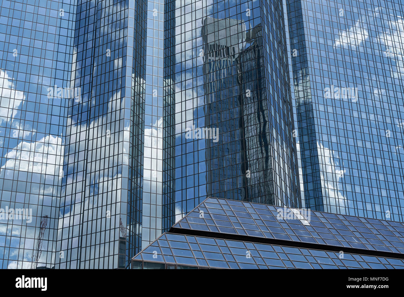 Modern glass facade of high-rise building in Frankfurt am Main with ...