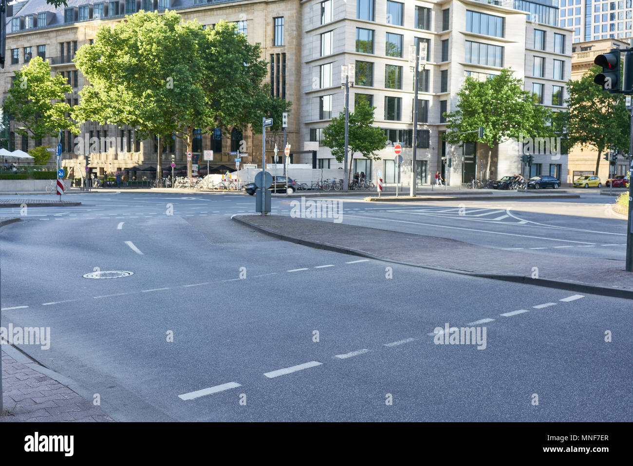 Road with junction and curve and pedestrian crossing in a german city ...