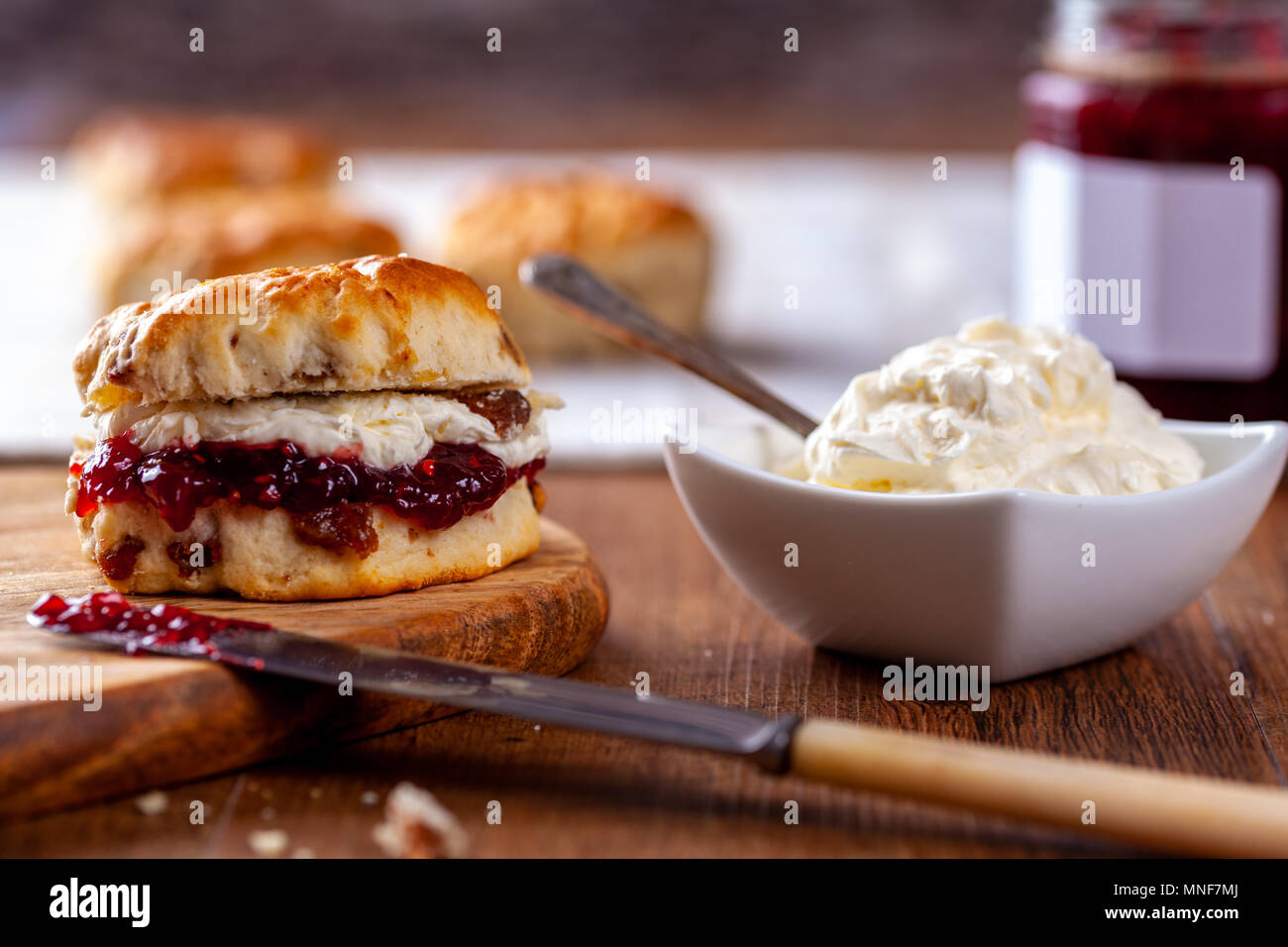Scones with Strawberry Jam and Clotted Cream Stock Photo - Alamy
