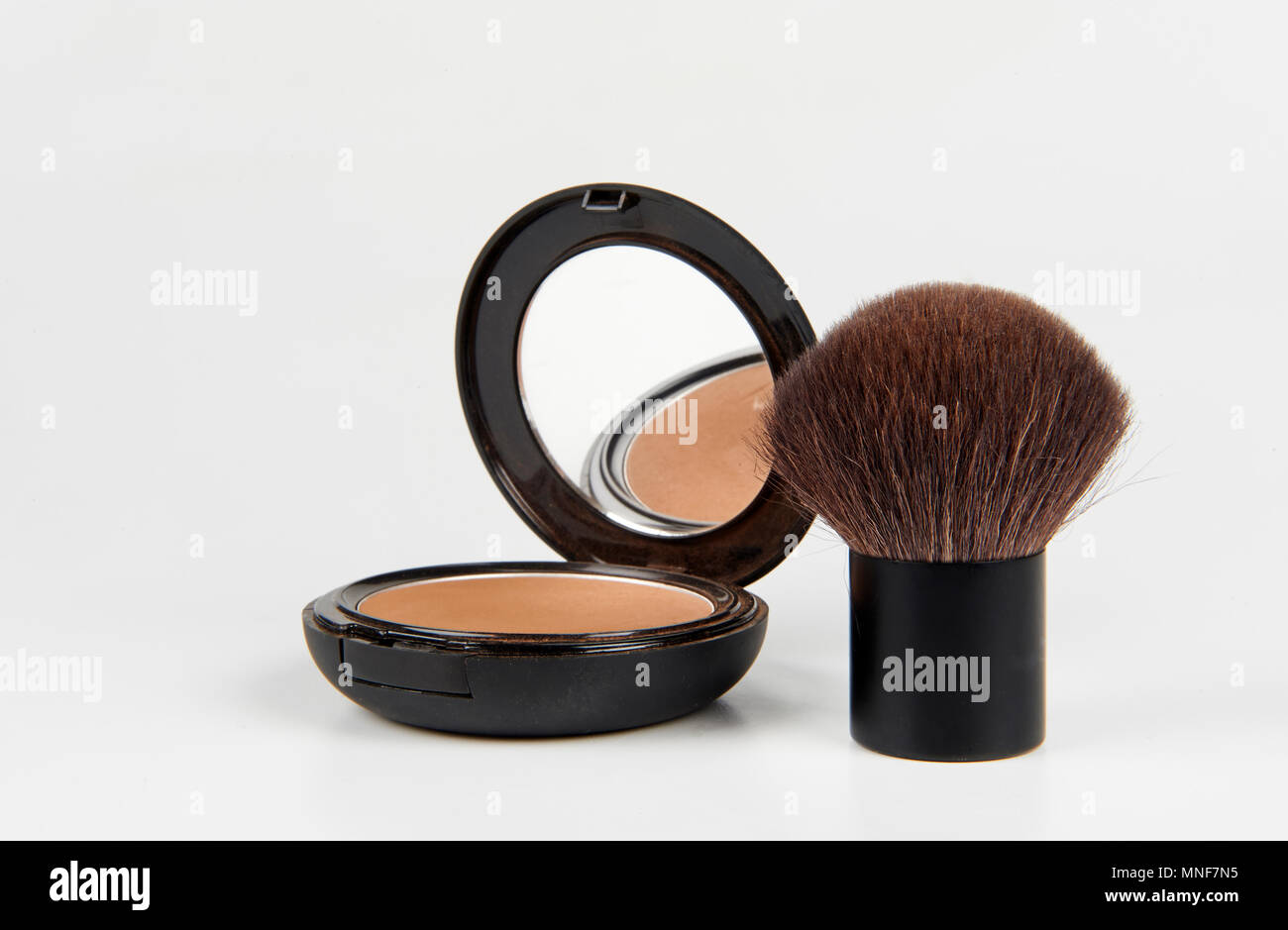 a make up ground and a brush Stock Photo - Alamy