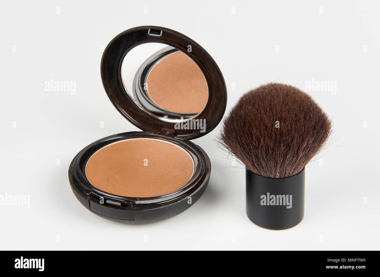 a make up ground and a brush Stock Photo - Alamy