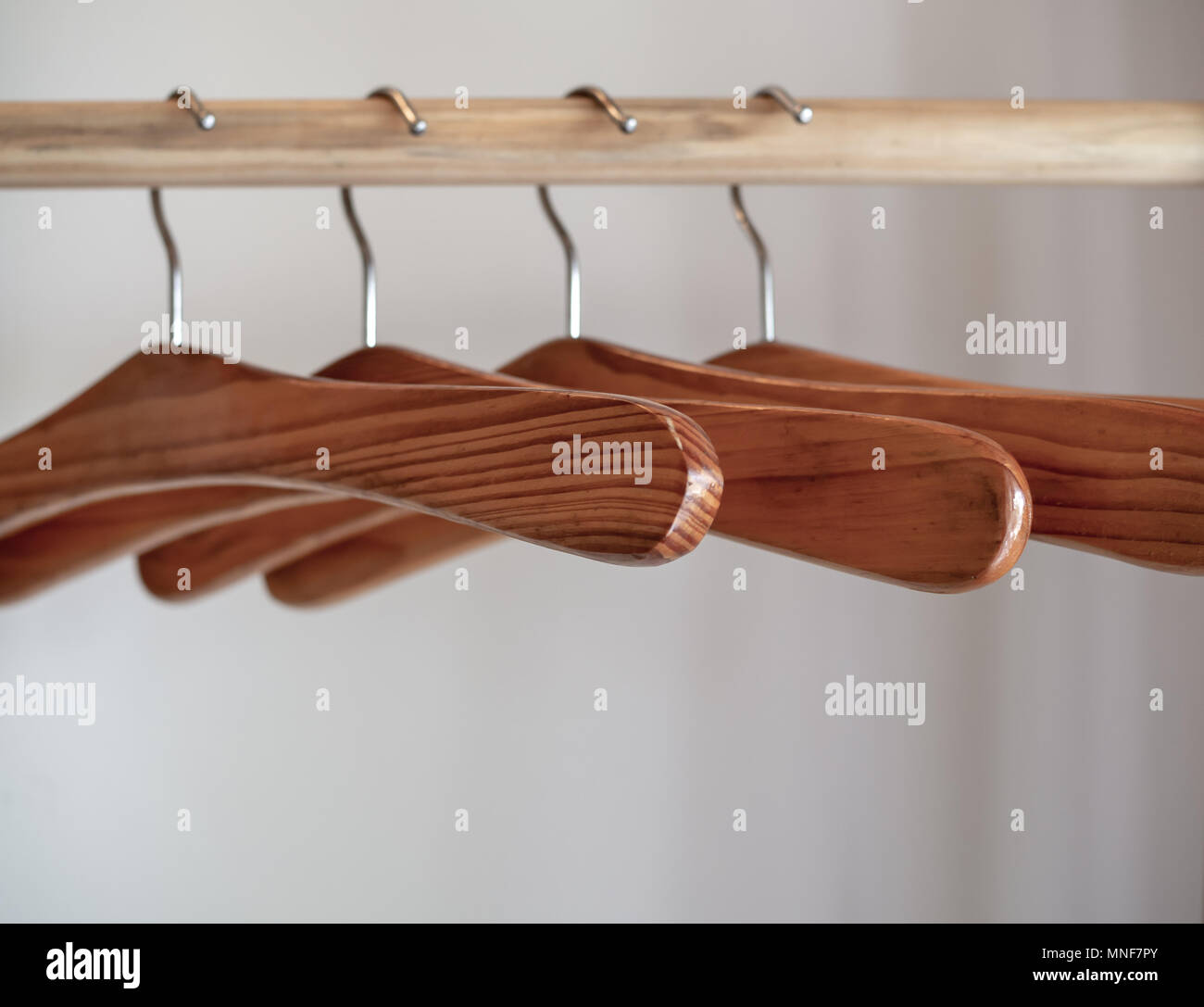 Close Up of Wooden Empty Hangers on White Wall Background in The Room ...