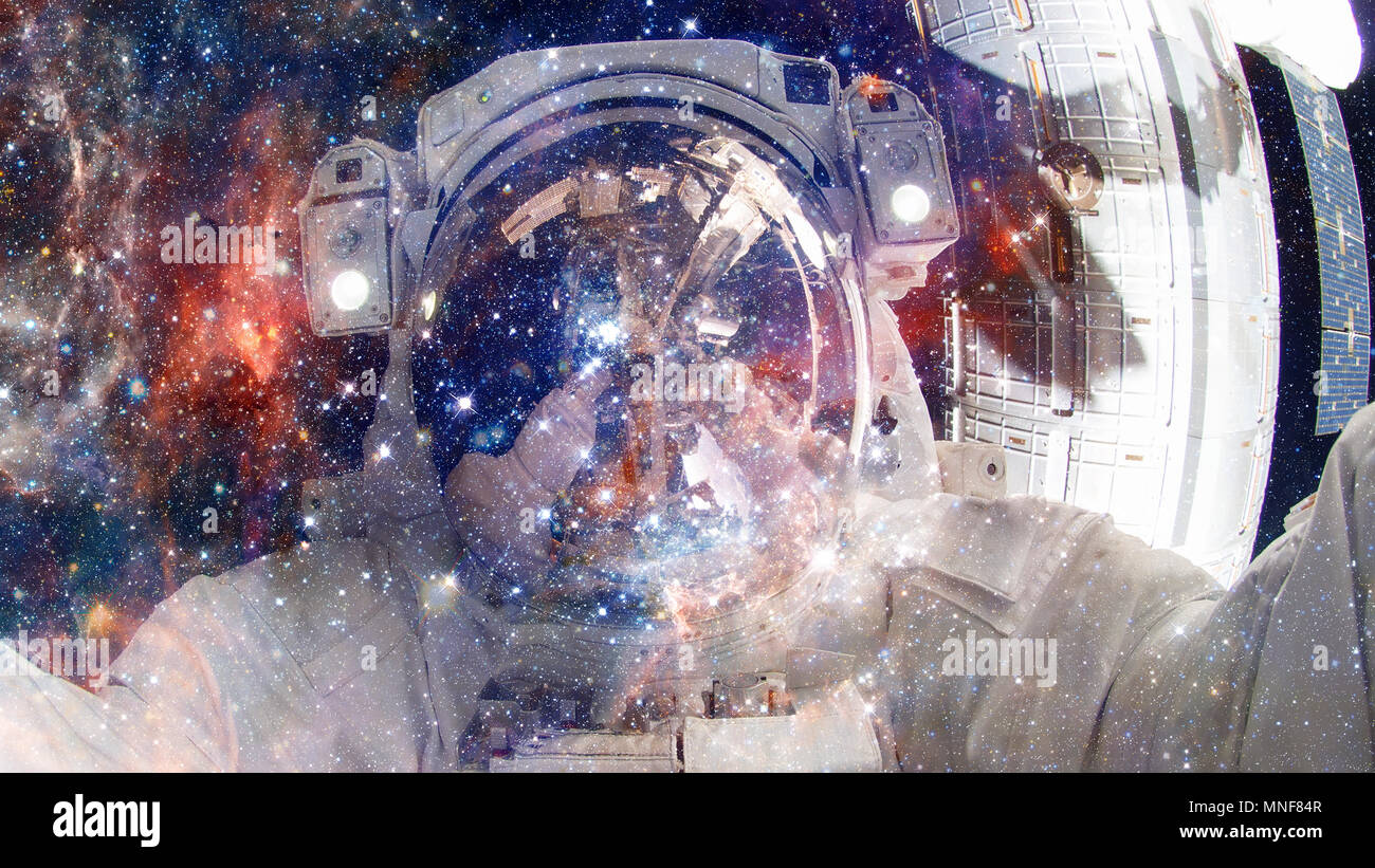 Astronaut in outer space. Science fiction art. Elements of this image ...