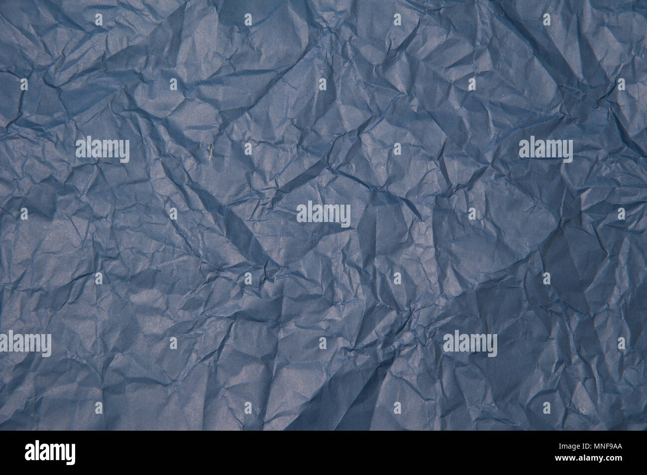 Crumpled blue paper texture for background Stock Photo - Alamy