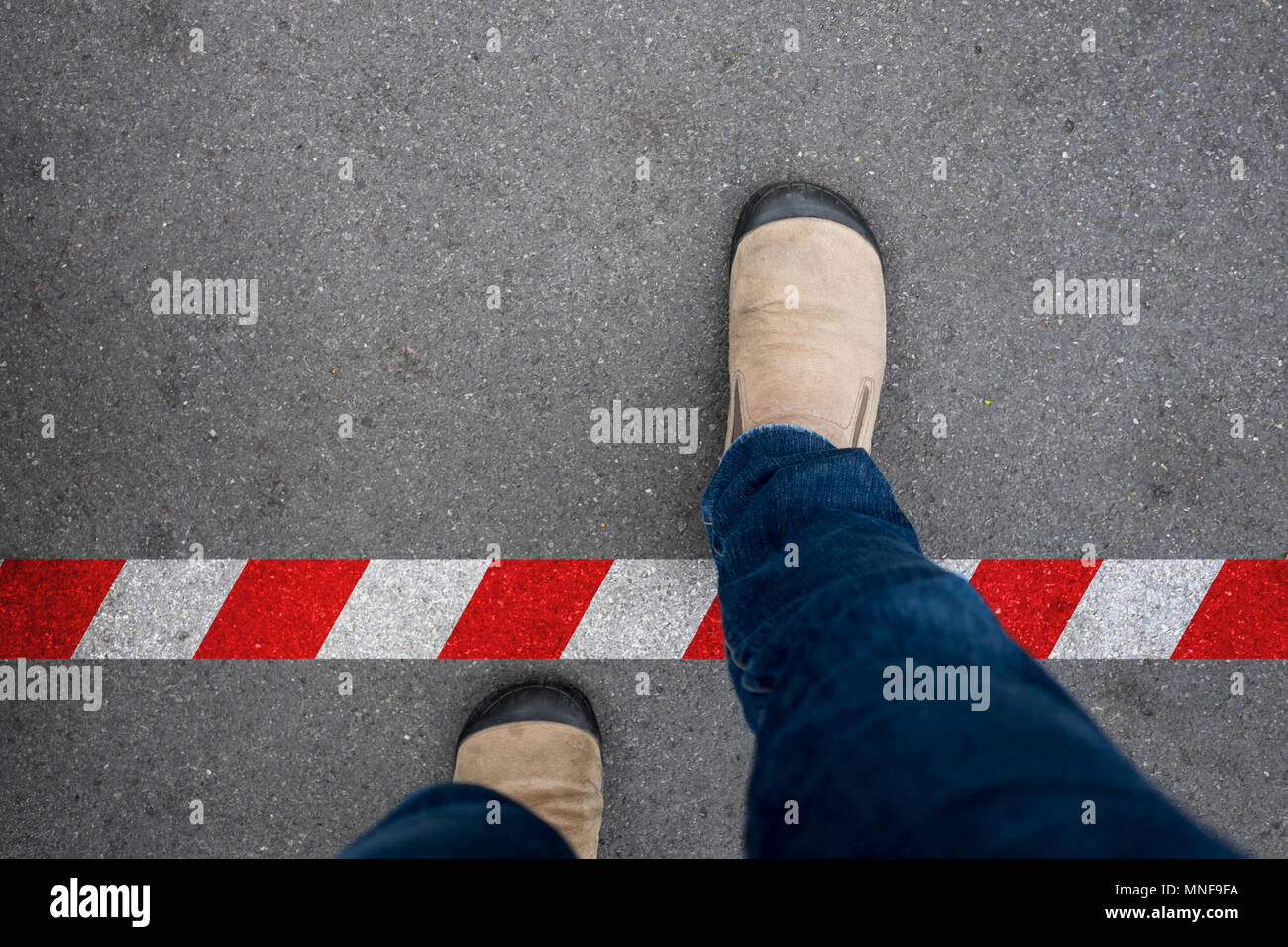 One walking across red and white line to prohibited area. Breaking the ...