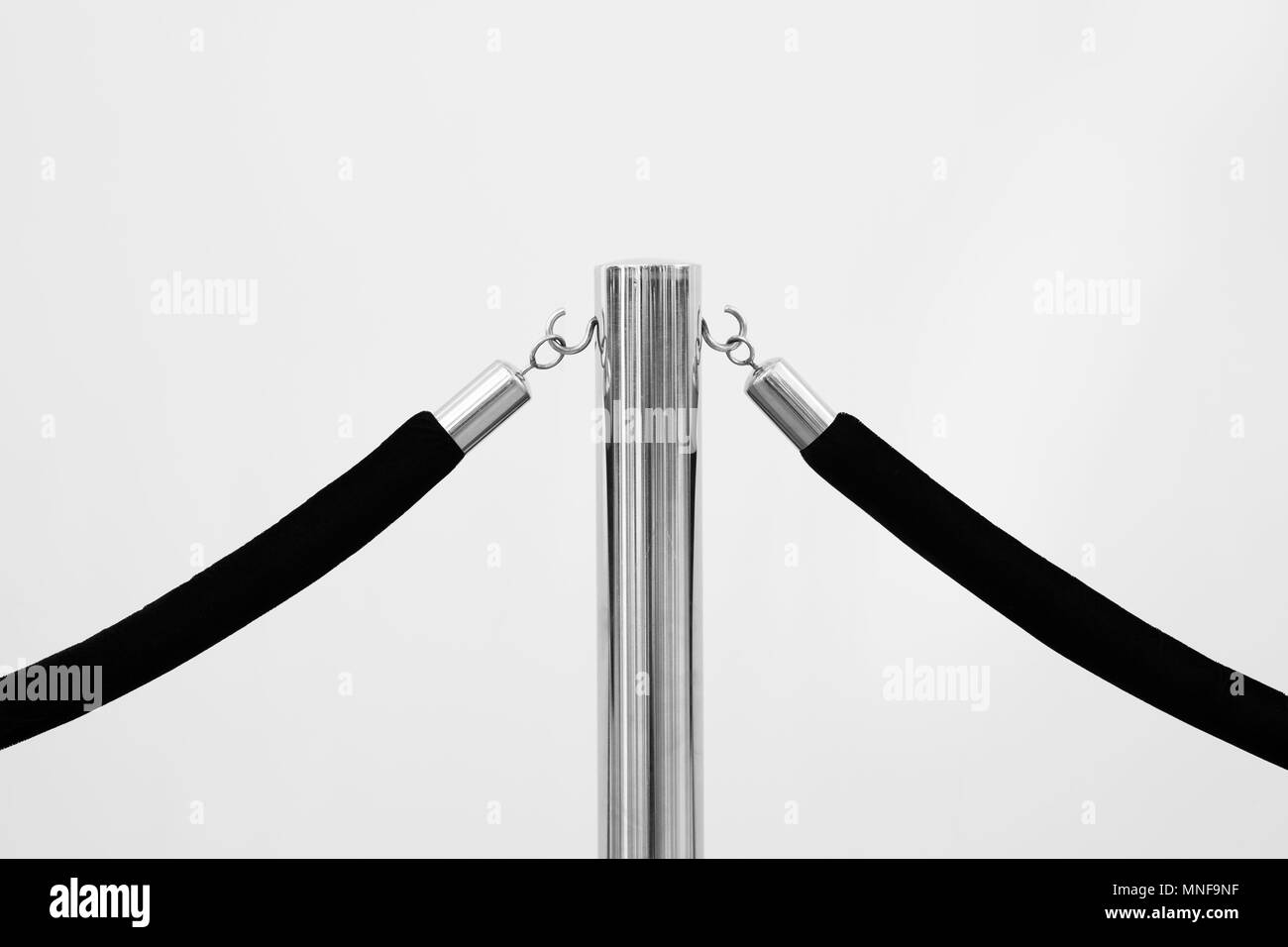 Stanchions barrior rope in black and white Stock Photo - Alamy