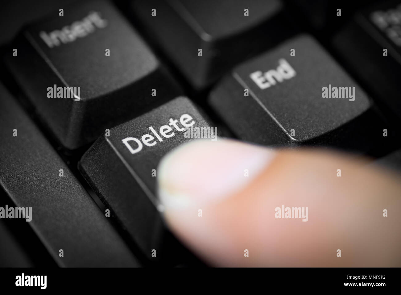 Pointing finger pressing on delete button on PC keyboard Stock Photo ... Pointing finger pressing on delete button on PC keyboard Stock Photo ...