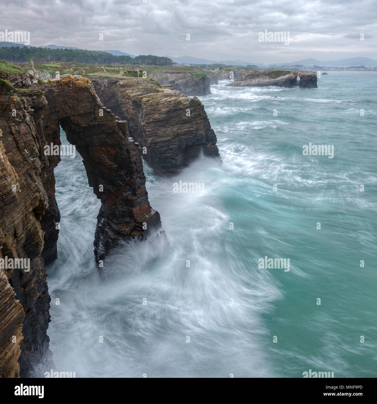Large waves hit the arches of As Catedrais beach, Ribadeo, Lugo ...