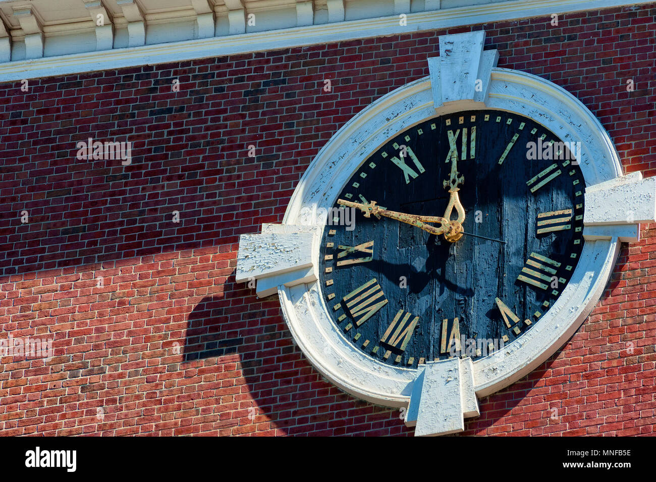 Clock on red brick wall hi-res stock photography and images - Alamy