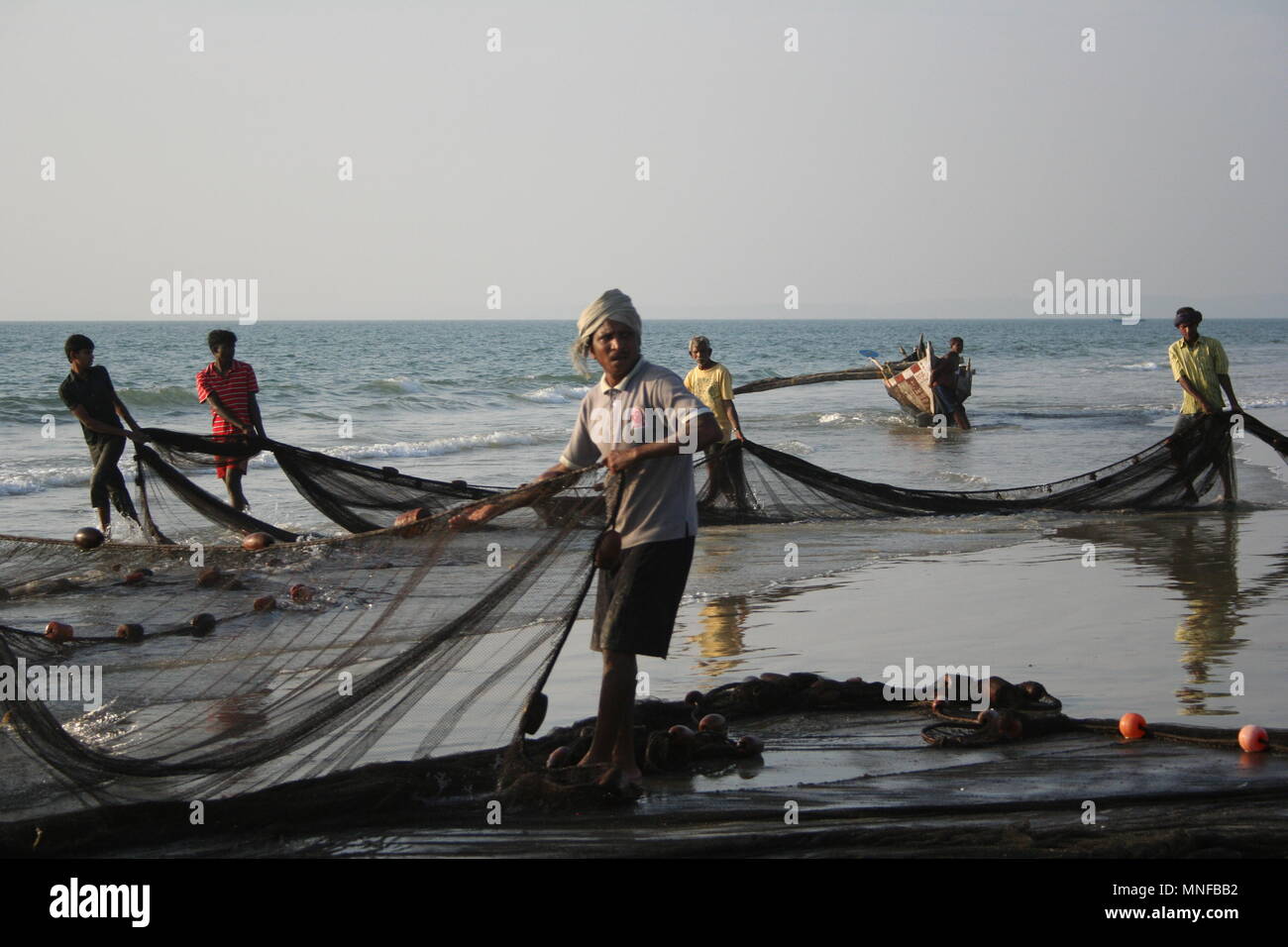 Indian Fishermen with Net on Beach, Colva, India Stock Photo - Alamy