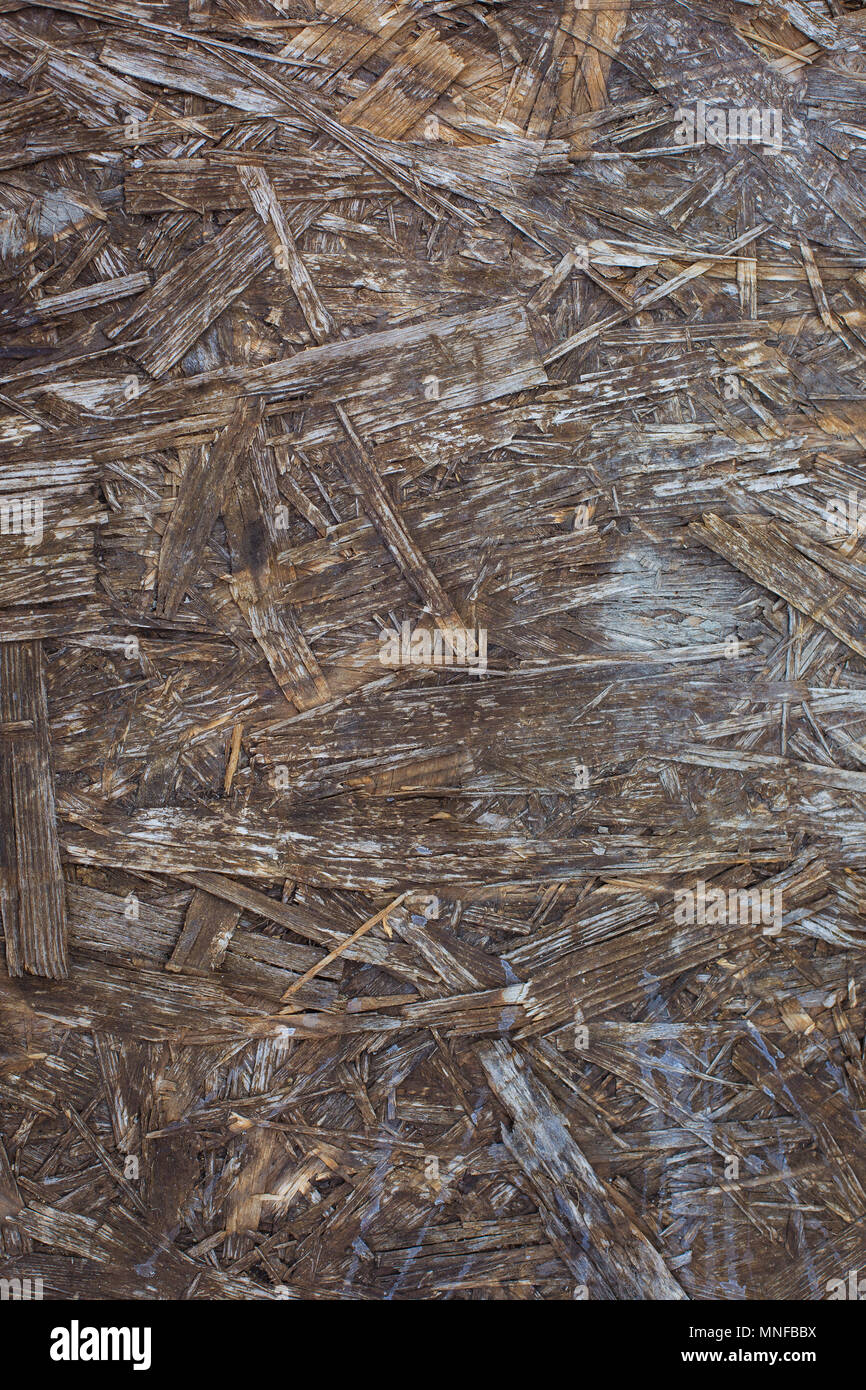 Old weathered chipboard texture close-up, grey background decoration ...