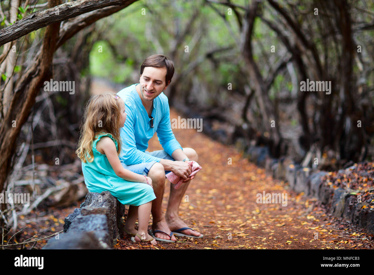 Father and daughter outdoors at beautiful forest Stock Photo - Alamy