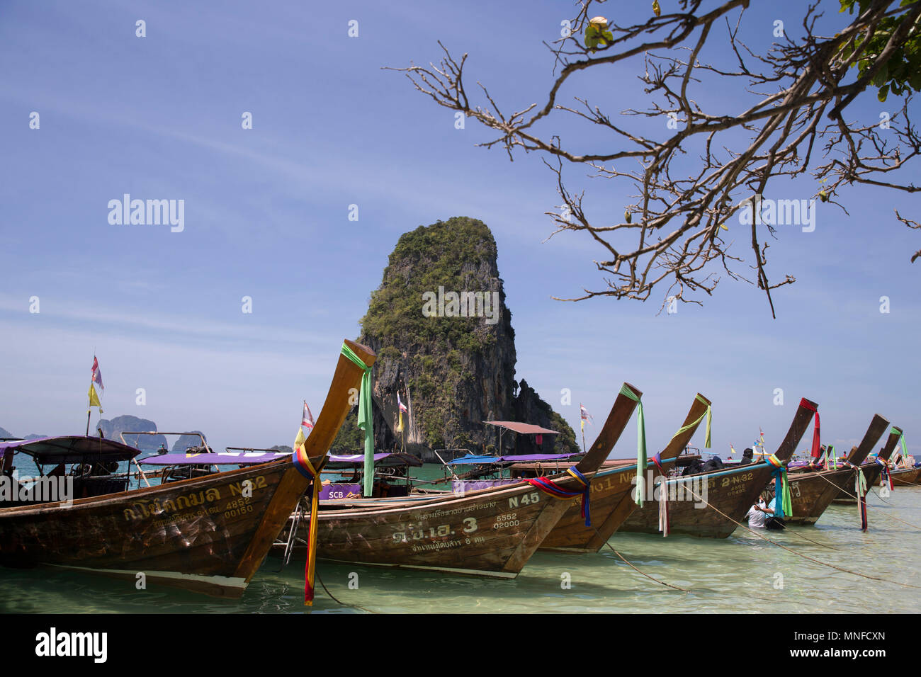 Long boats moored at southern Thailand's Railey beach Stock Photo - Alamy
