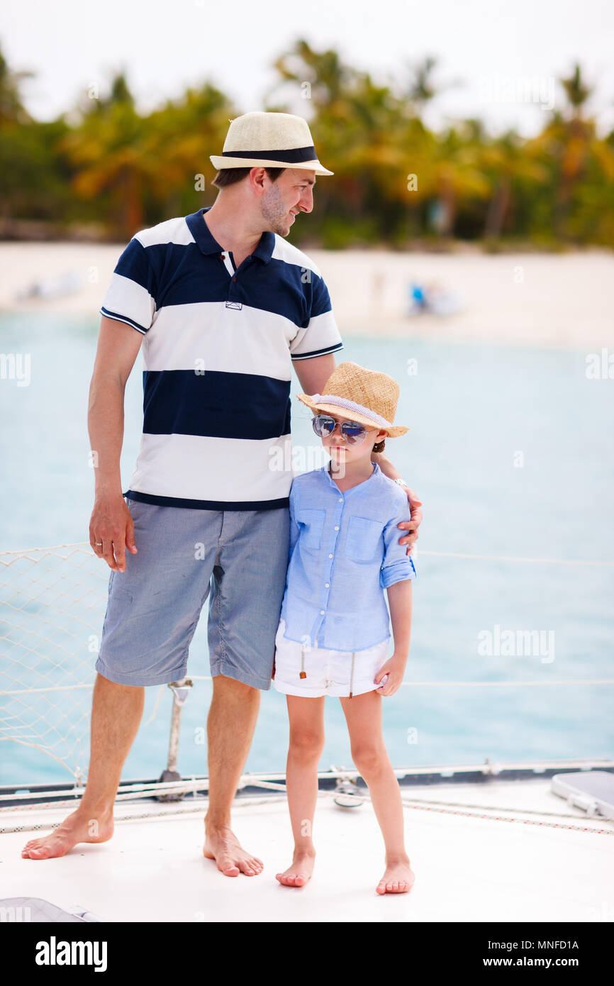 Happy father and his adorable little daughter outdoors sailing on yacht ...
