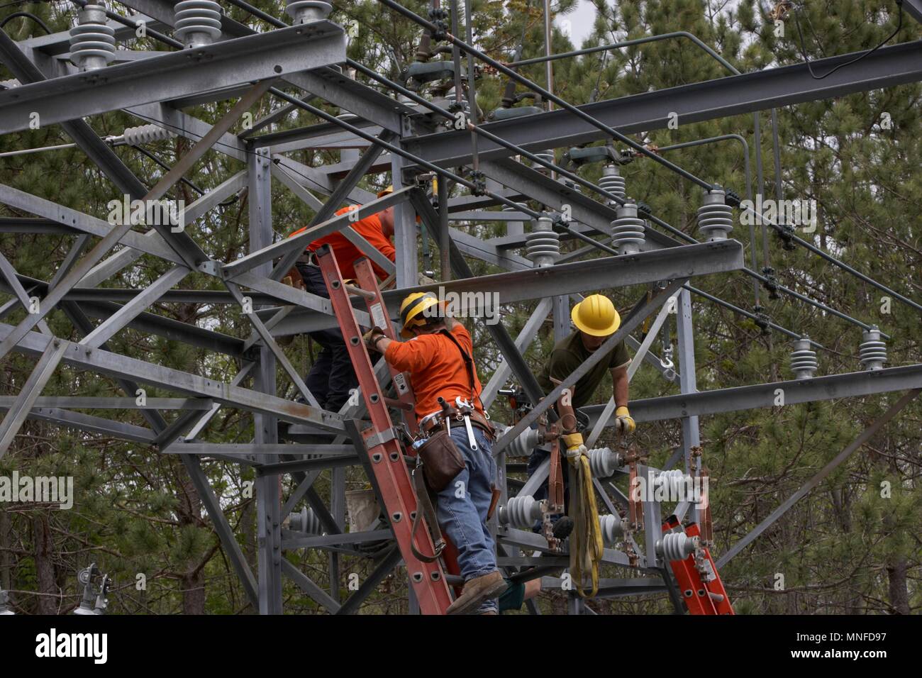 Utility workman installing updated components to a "city gate ...