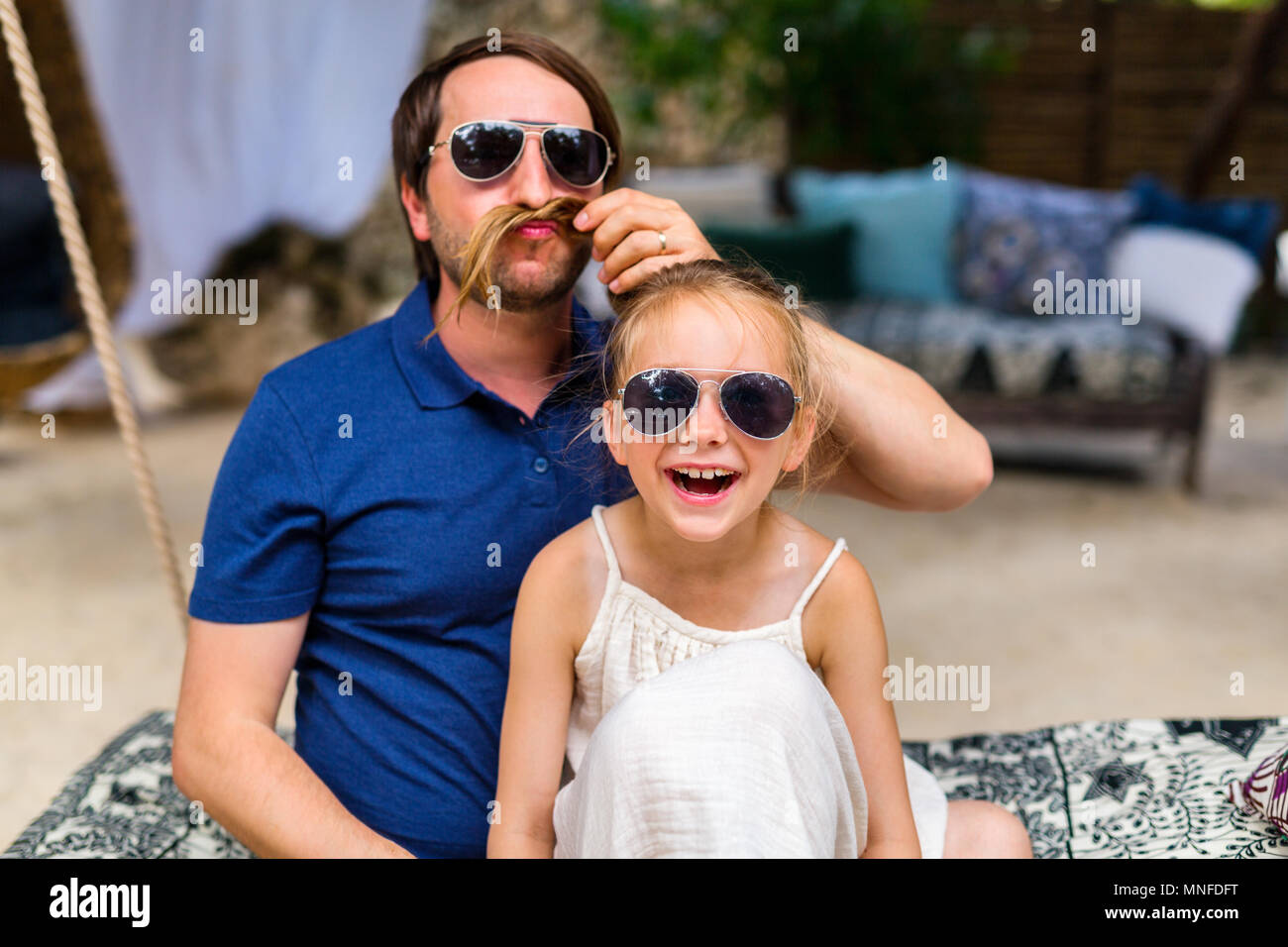 Happy father and his adorable little daughter laughing together having ...