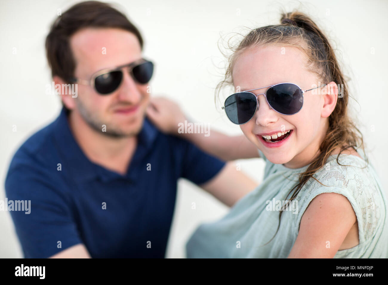 Happy father and his adorable little daughter laughing together having ...