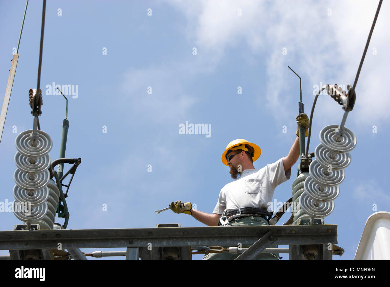 Utility workman installing updated components to a "city gate ...