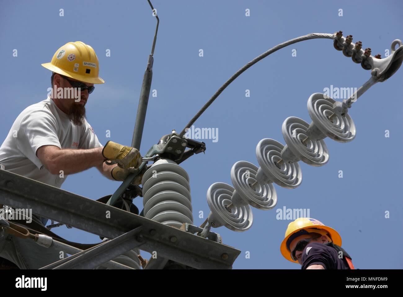 Utility workman installing updated components to a "city gate ...