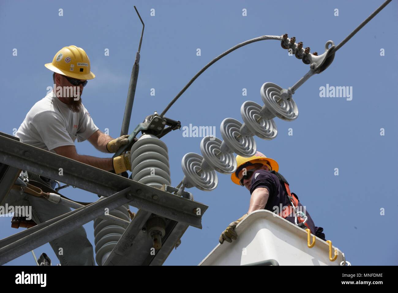 Utility workman installing updated components to a "city gate ...