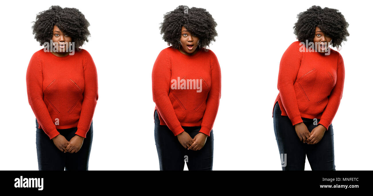 Young beautiful african plus size model scared in shock, expressing ...
