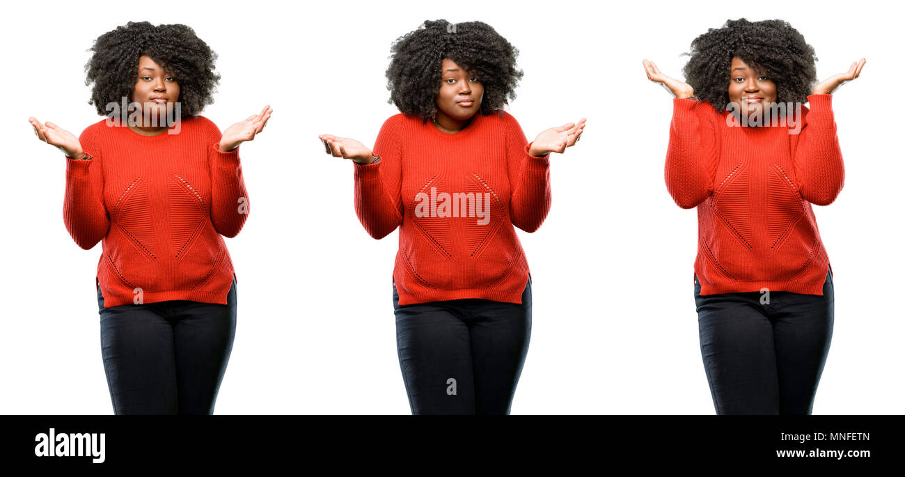 Young beautiful african plus size model doubt expression, confuse and ...