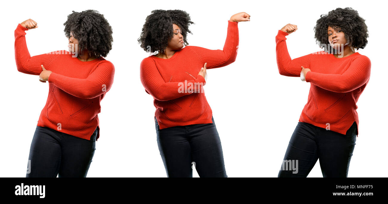 Young beautiful african plus size model pointing biceps expressing ...