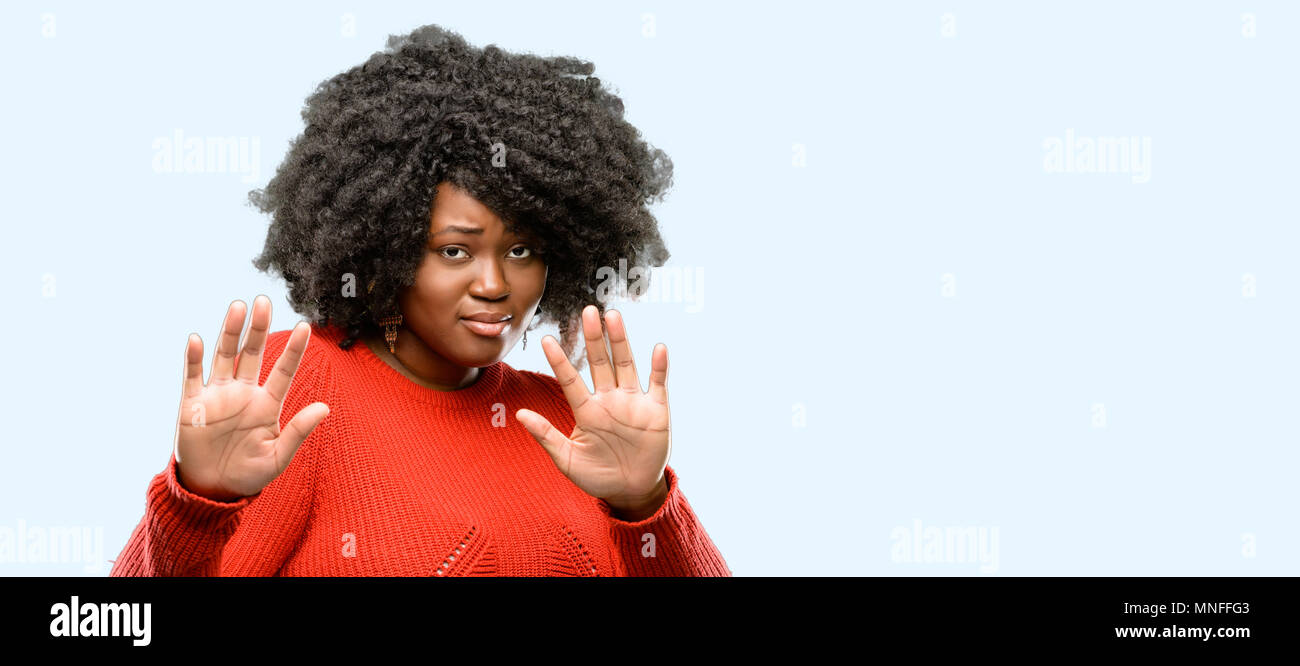 Beautiful african woman disgusted and angry, keeping hands in stop ...