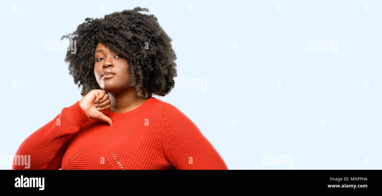 Beautiful african woman proud, excited and arrogant, pointing with ...