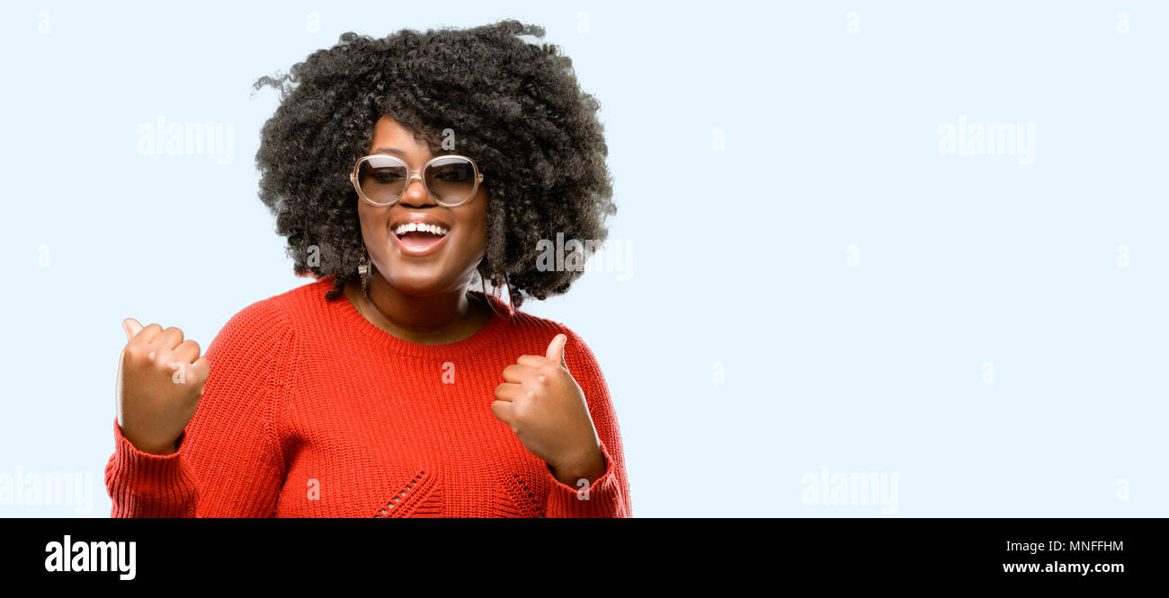 Beautiful african woman happy and excited celebrating victory ...
