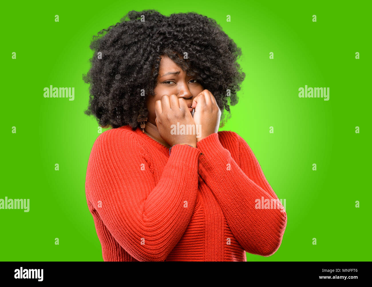 Beautiful african woman terrified and nervous expressing anxiety and ...