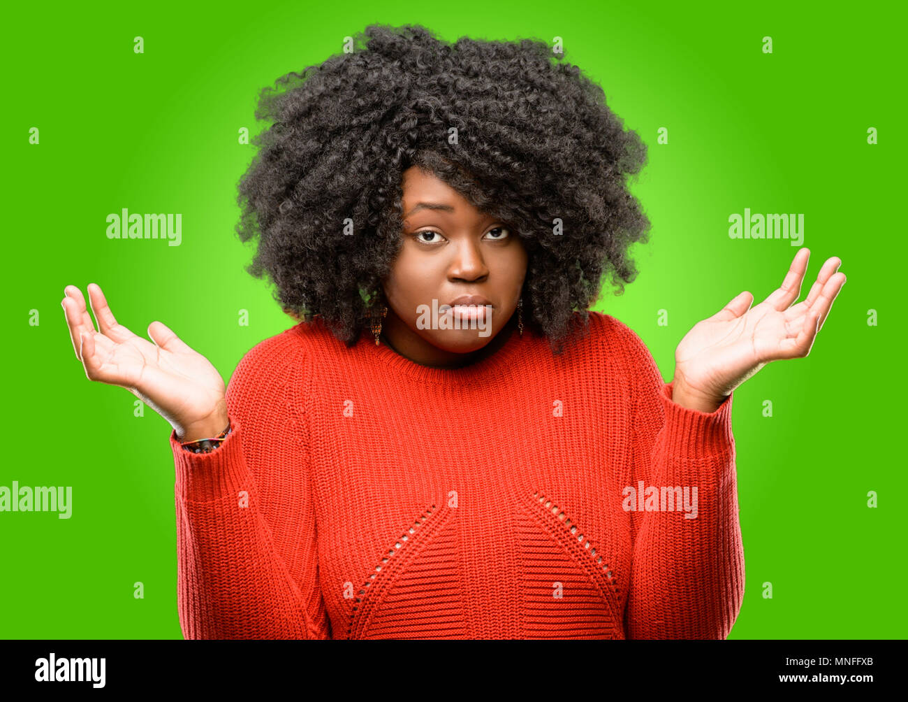 Beautiful african woman doubt expression, confuse and wonder concept ...