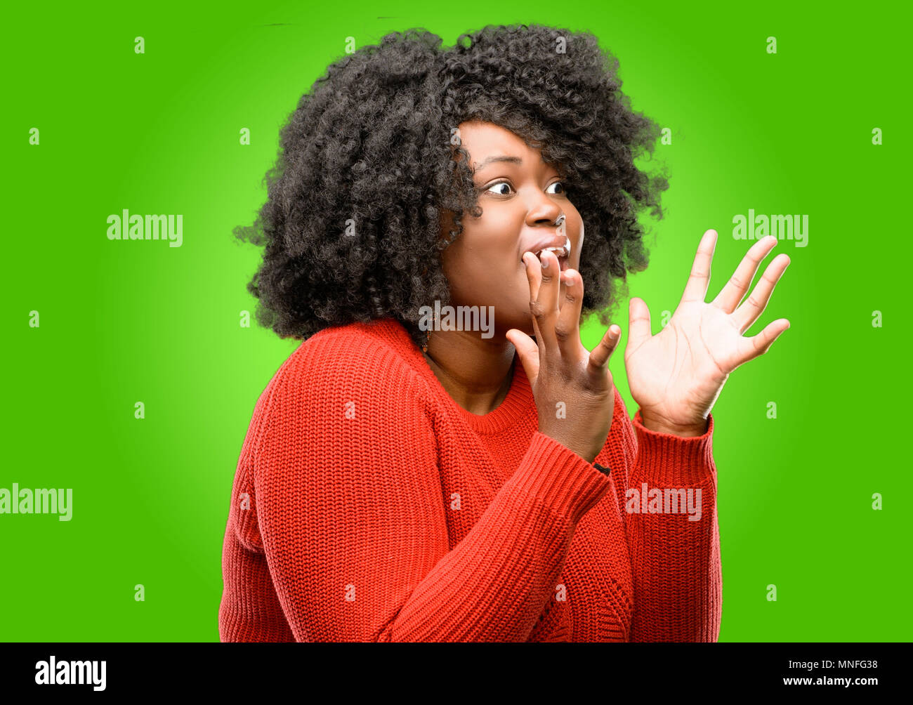 Beautiful african woman stressful keeping hands on head, terrified in ...