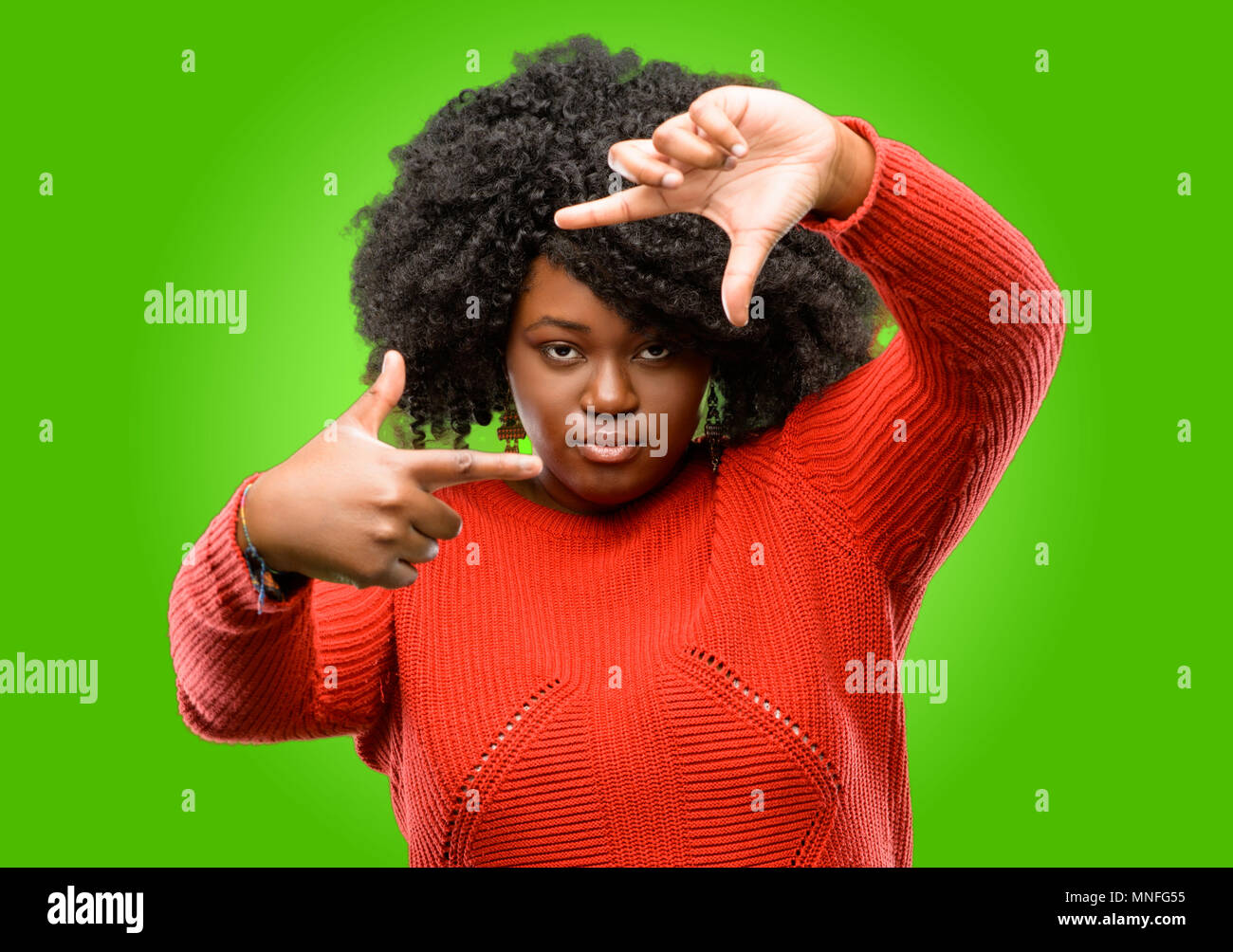 Beautiful african woman confident and happy showing hands to camera ...