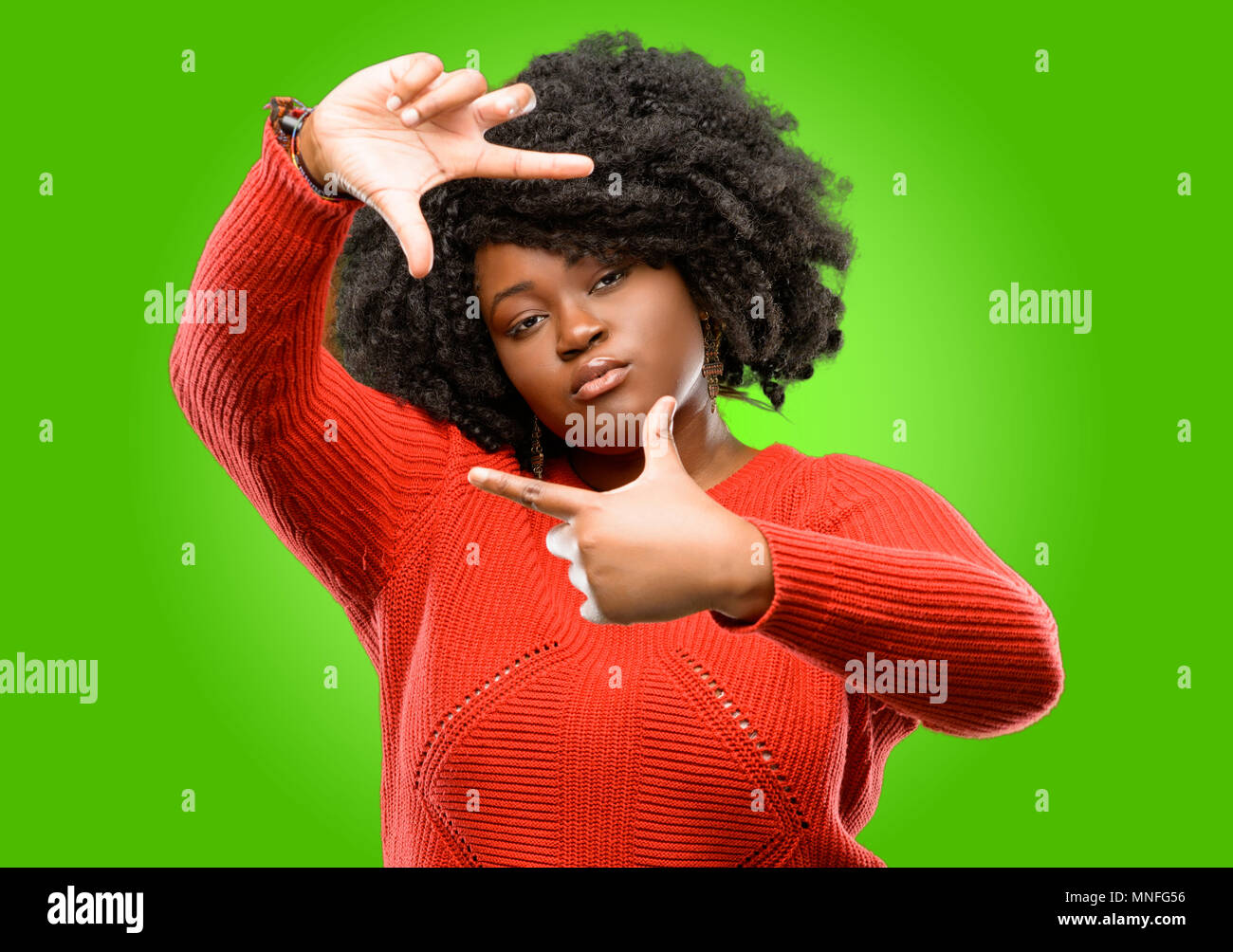 Beautiful african woman confident and happy showing hands to camera ...
