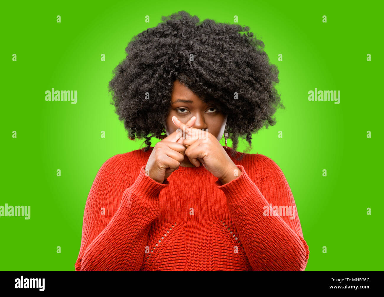 Beautiful african woman annoyed with bad attitude making stop sign with ...