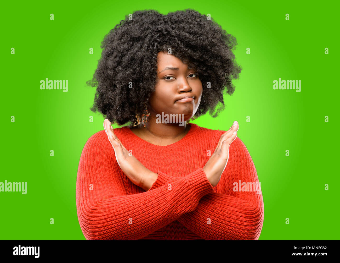 Beautiful african woman annoyed with bad attitude making stop sign ...