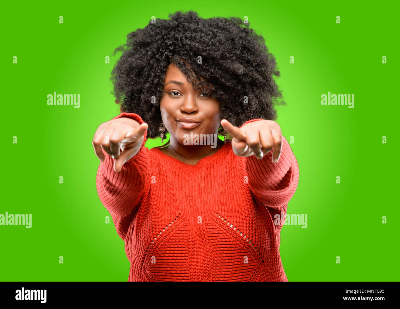 Beautiful african woman pointing to the front with finger Stock Photo ...