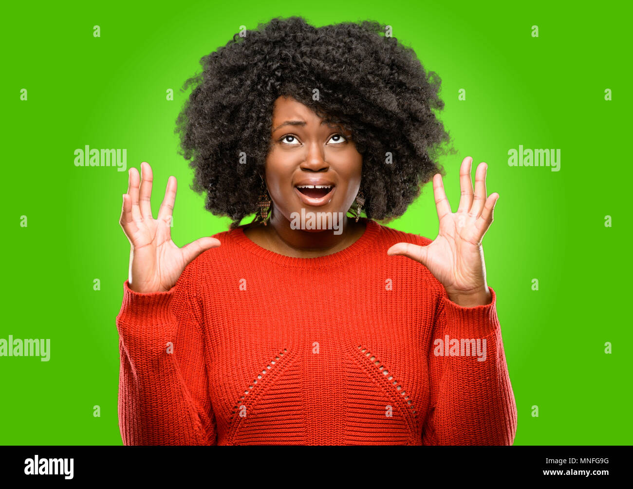 Beautiful african woman terrified and nervous expressing anxiety and ...