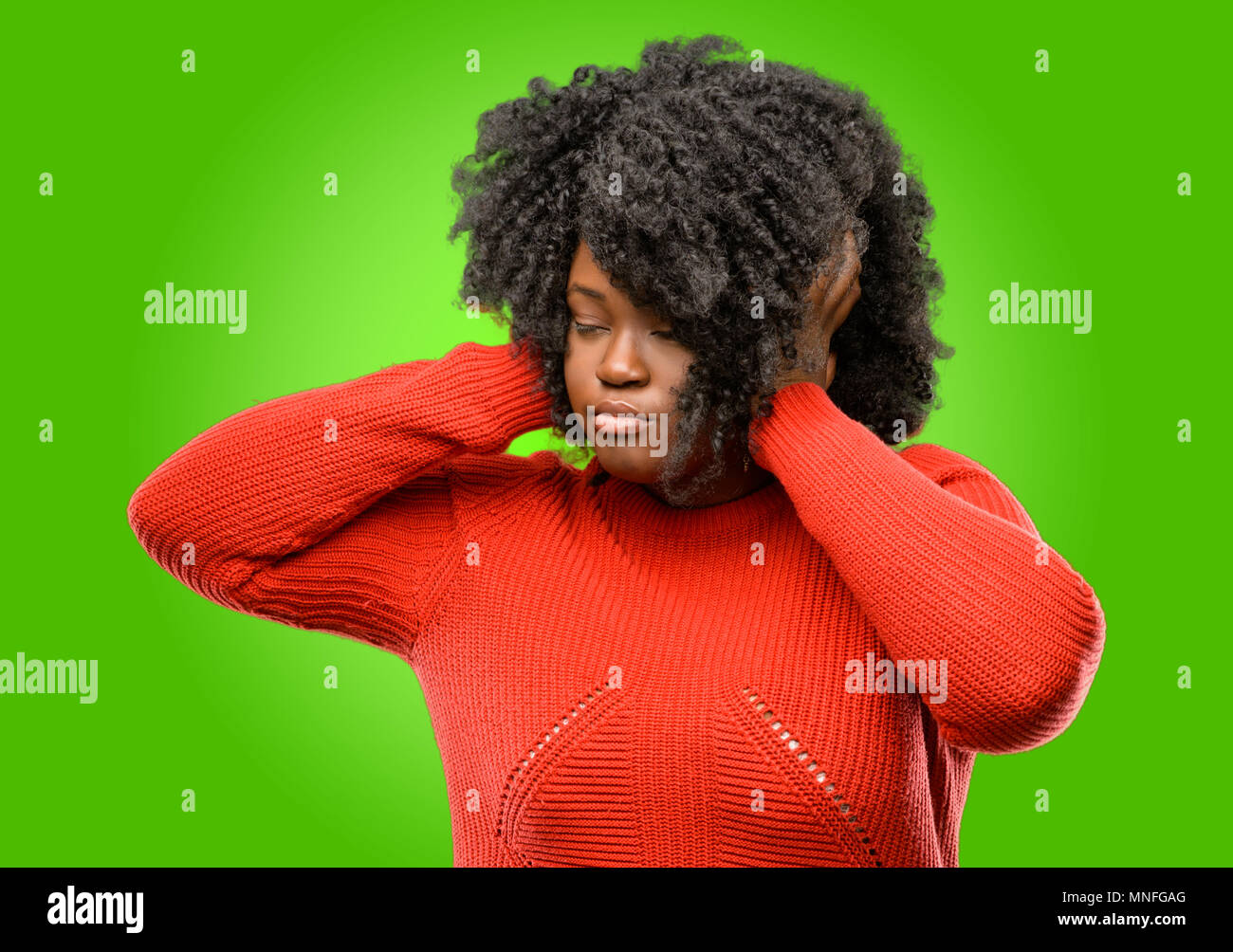 Beautiful african woman covering ears ignoring annoying loud noise ...