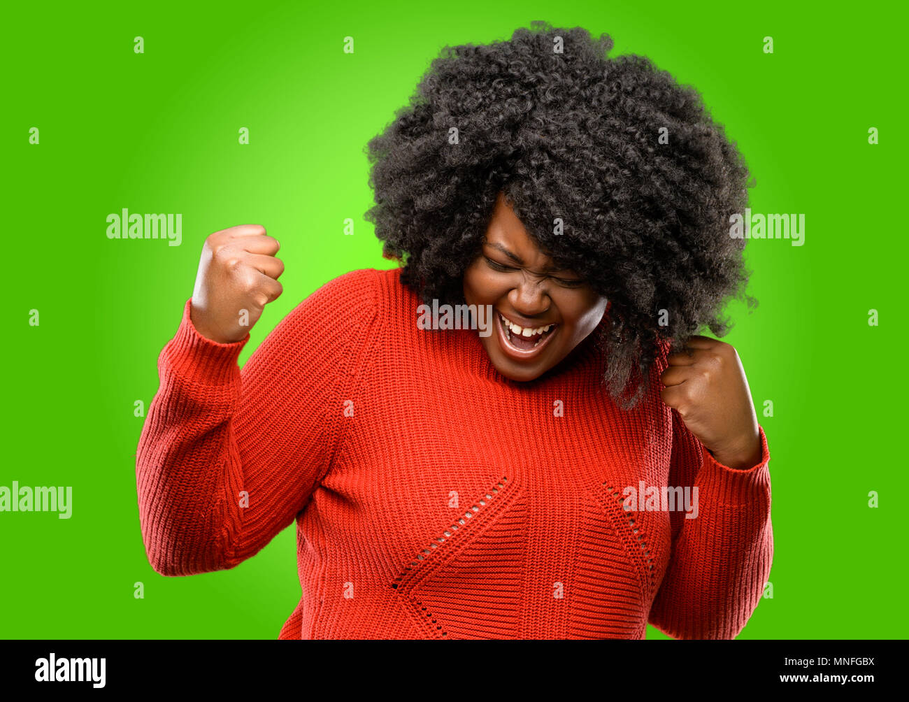 Beautiful african woman happy and excited expressing winning gesture ...
