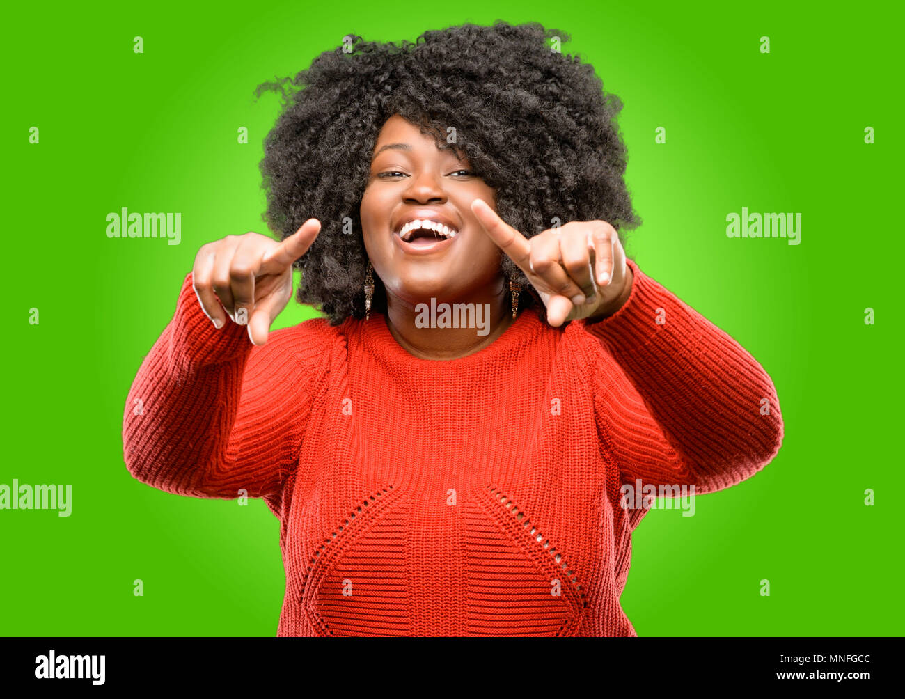 Beautiful african woman pointing to the front with finger Stock Photo ...