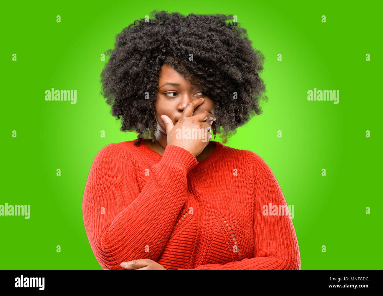 Beautiful african woman scared in shock, expressing panic and fear ...